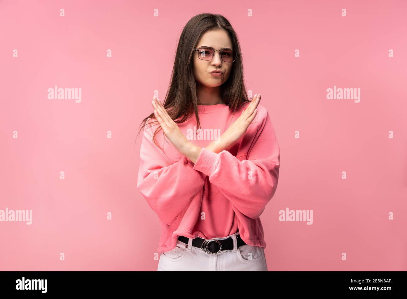Photo of attractive young woman in glasses, not allow to do something ...