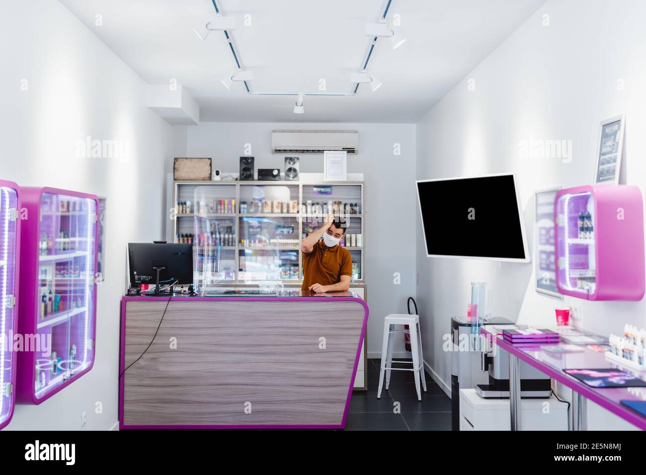 Frustrated owner in his store during coronavirus pandemic Stock Photo ...