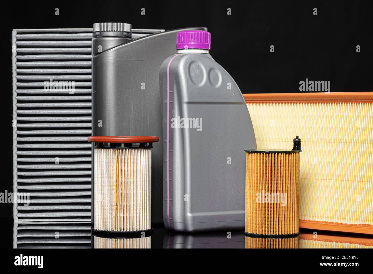 Car oil filters and motor oil can on dark background Stock Photo - Alamy