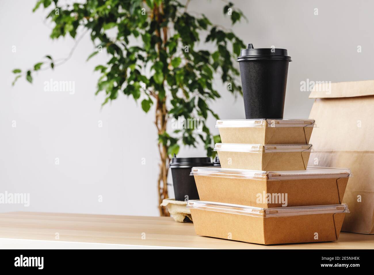 Assortment of various food delivery containers on table Stock Photo - Alamy