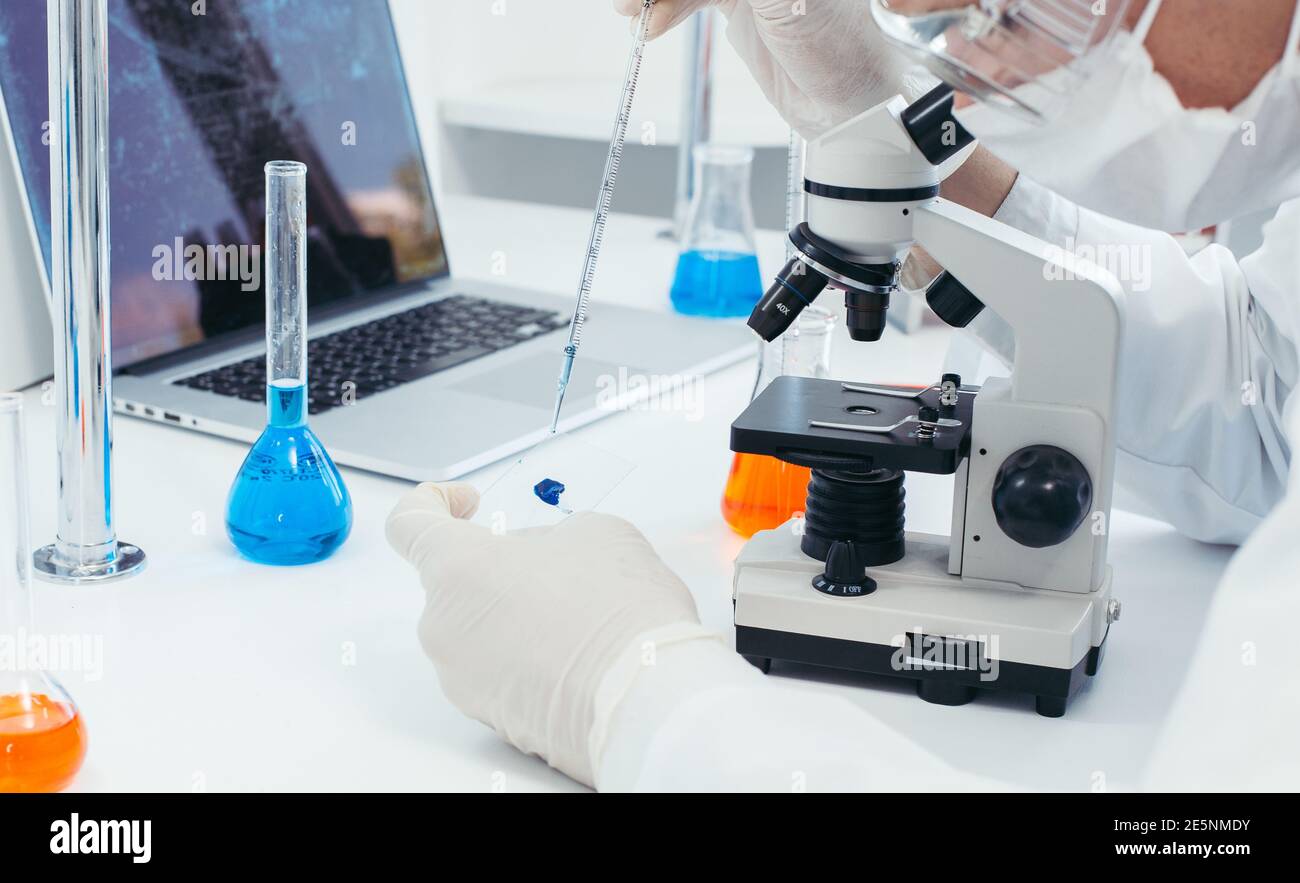 close up. scientist works with a microscope in a medical laboratory ...