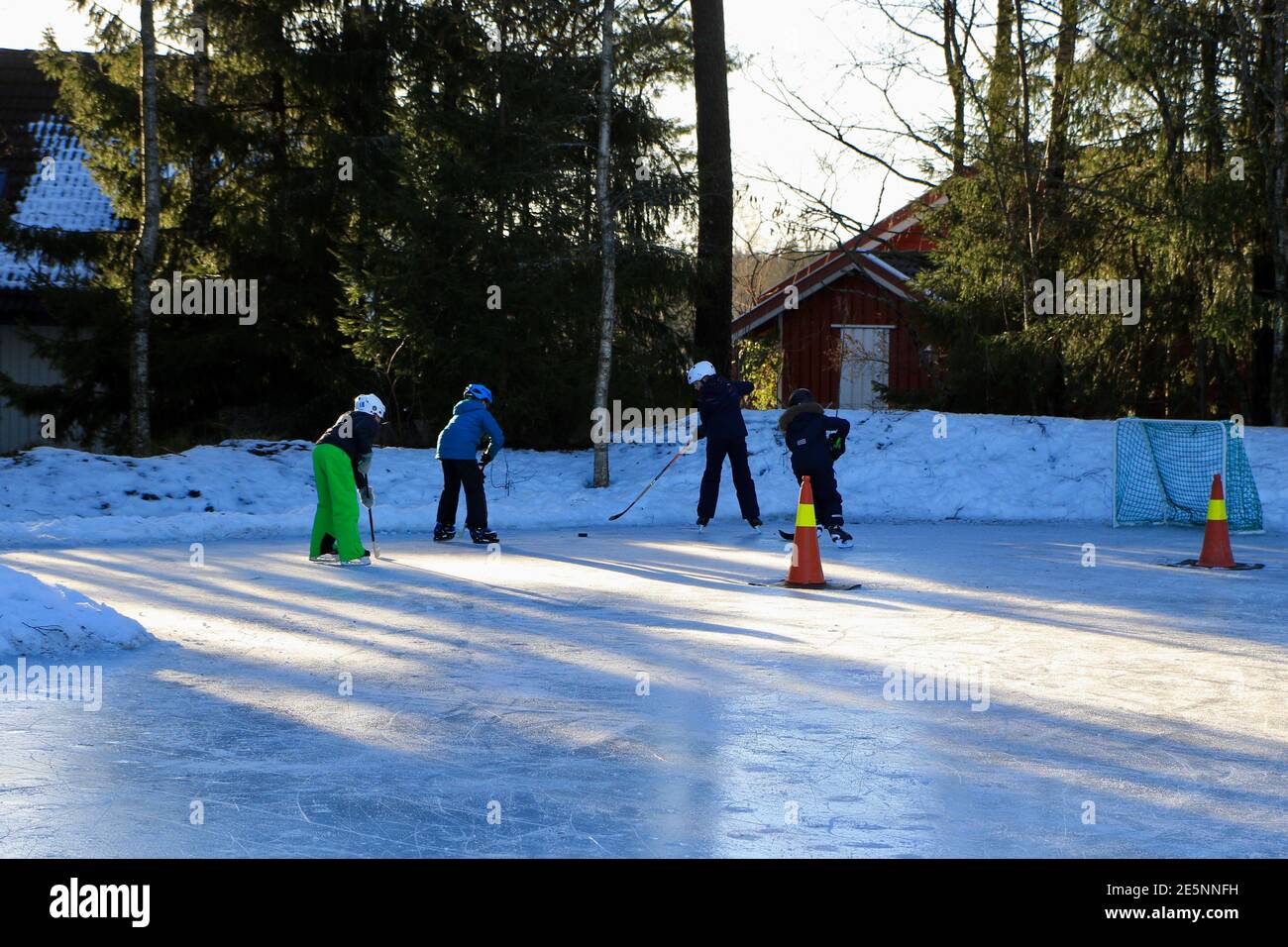 Kids playing on ice hi-res stock photography and images - Alamy