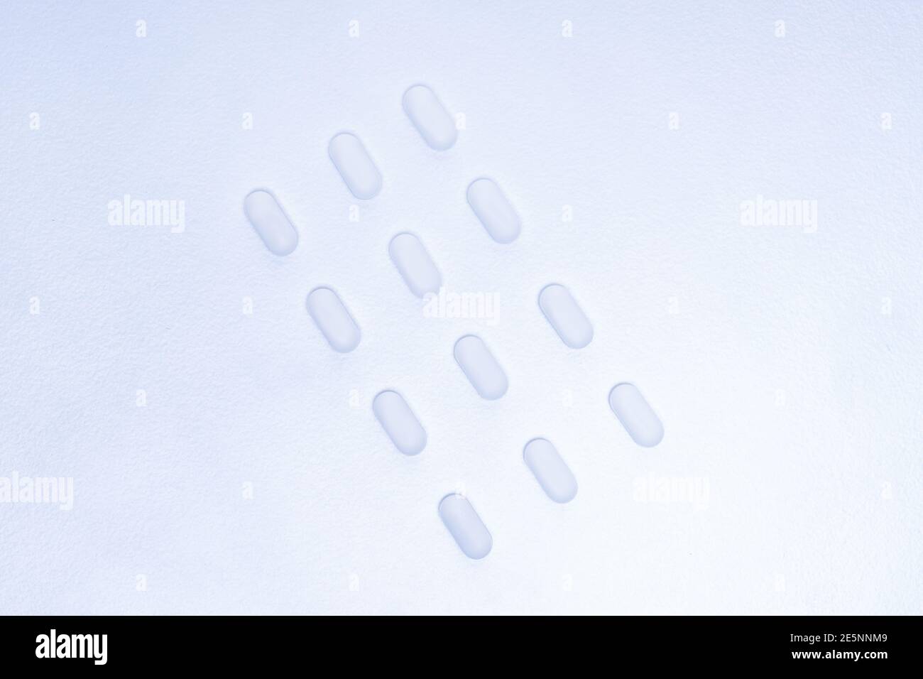 image of white tablets on a white background Stock Photo - Alamy