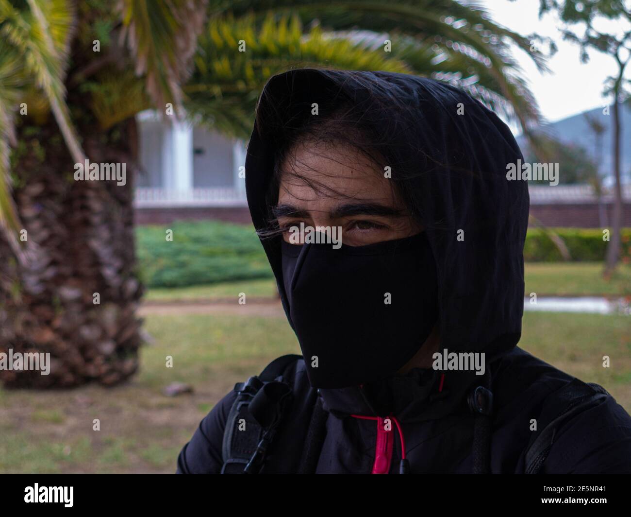 young woman with mas in the beach in pandemic winter Stock Photo - Alamy