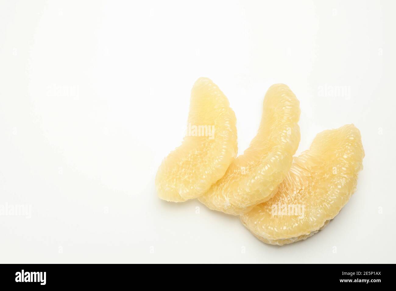 Ripe pomelo fruit slices on white background Stock Photo - Alamy