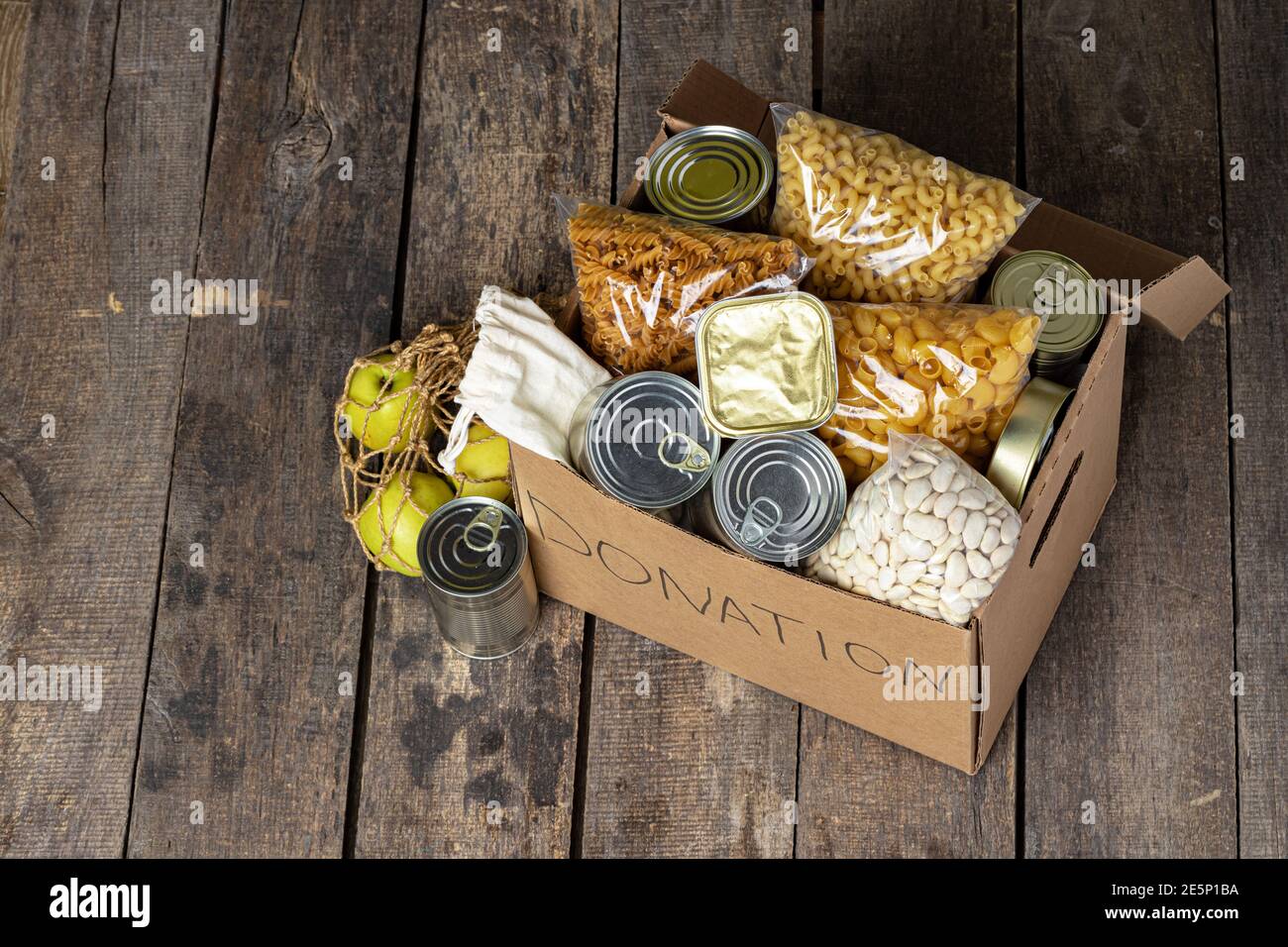 Food donations on the table. Text Donation Stock Photo - Alamy