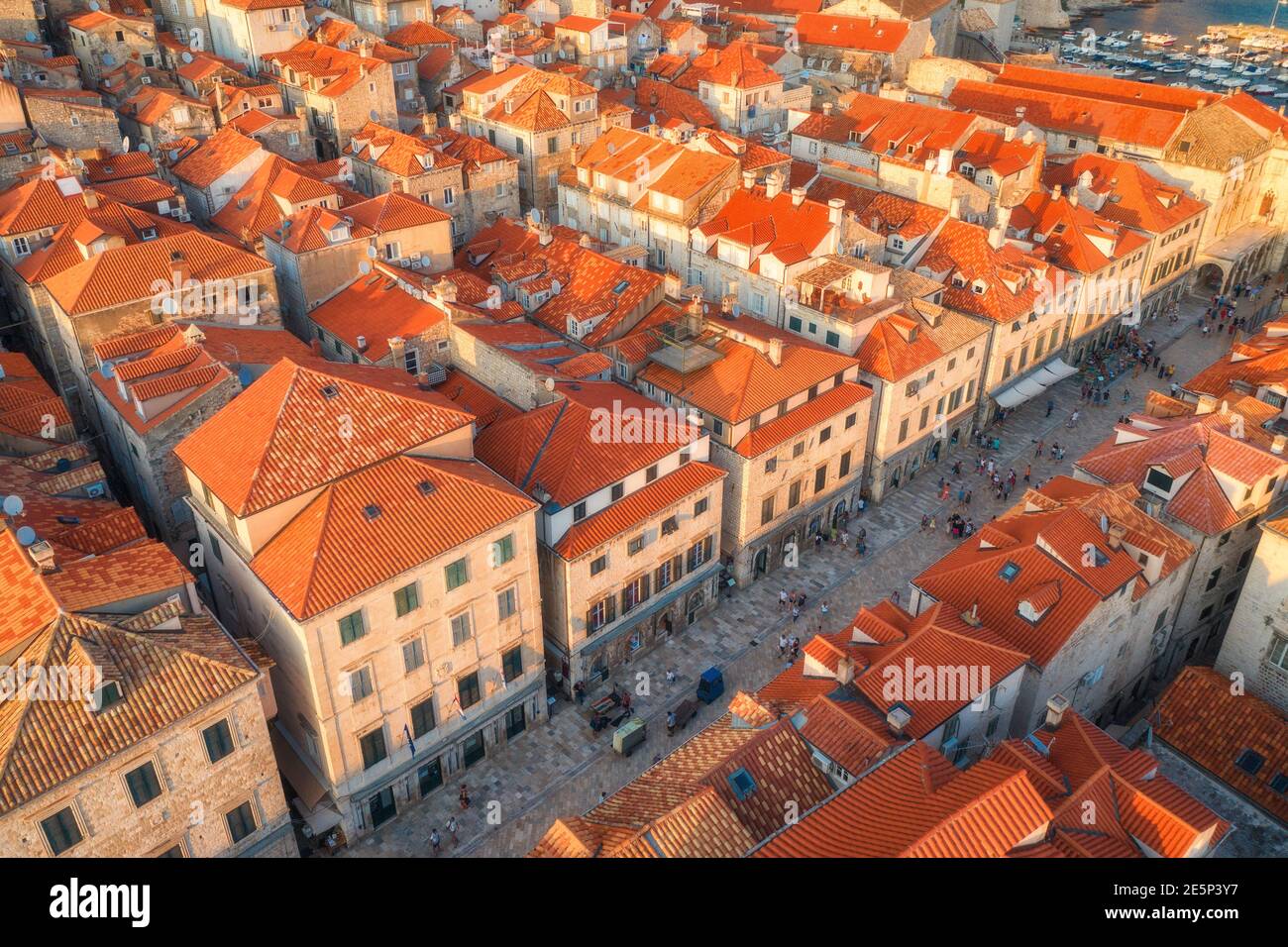 Aerial view of houses with orange roofs at sunset in summer Stock Photo ...