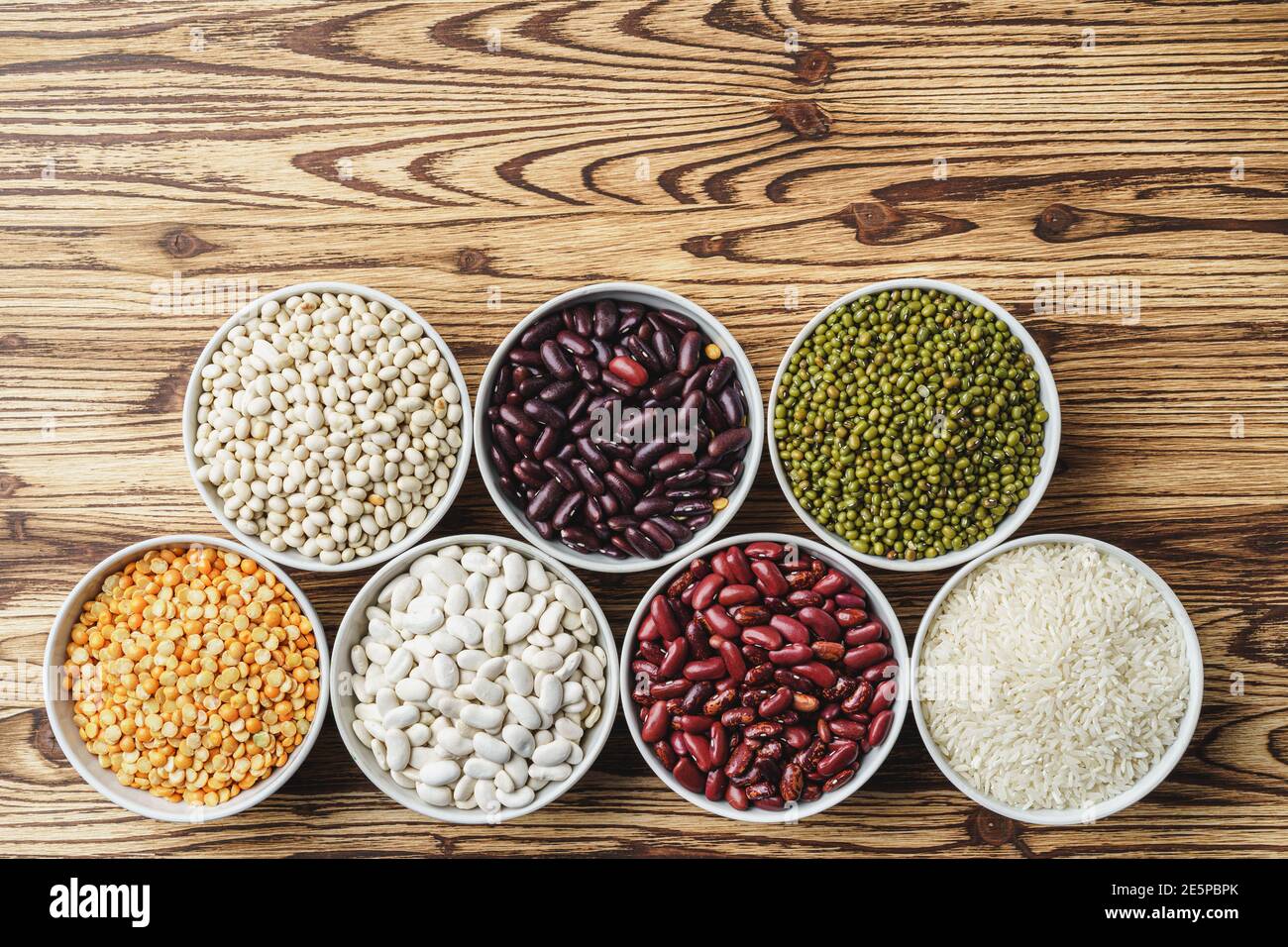 Assortment of beans on wooden background. Close up Stock Photo - Alamy