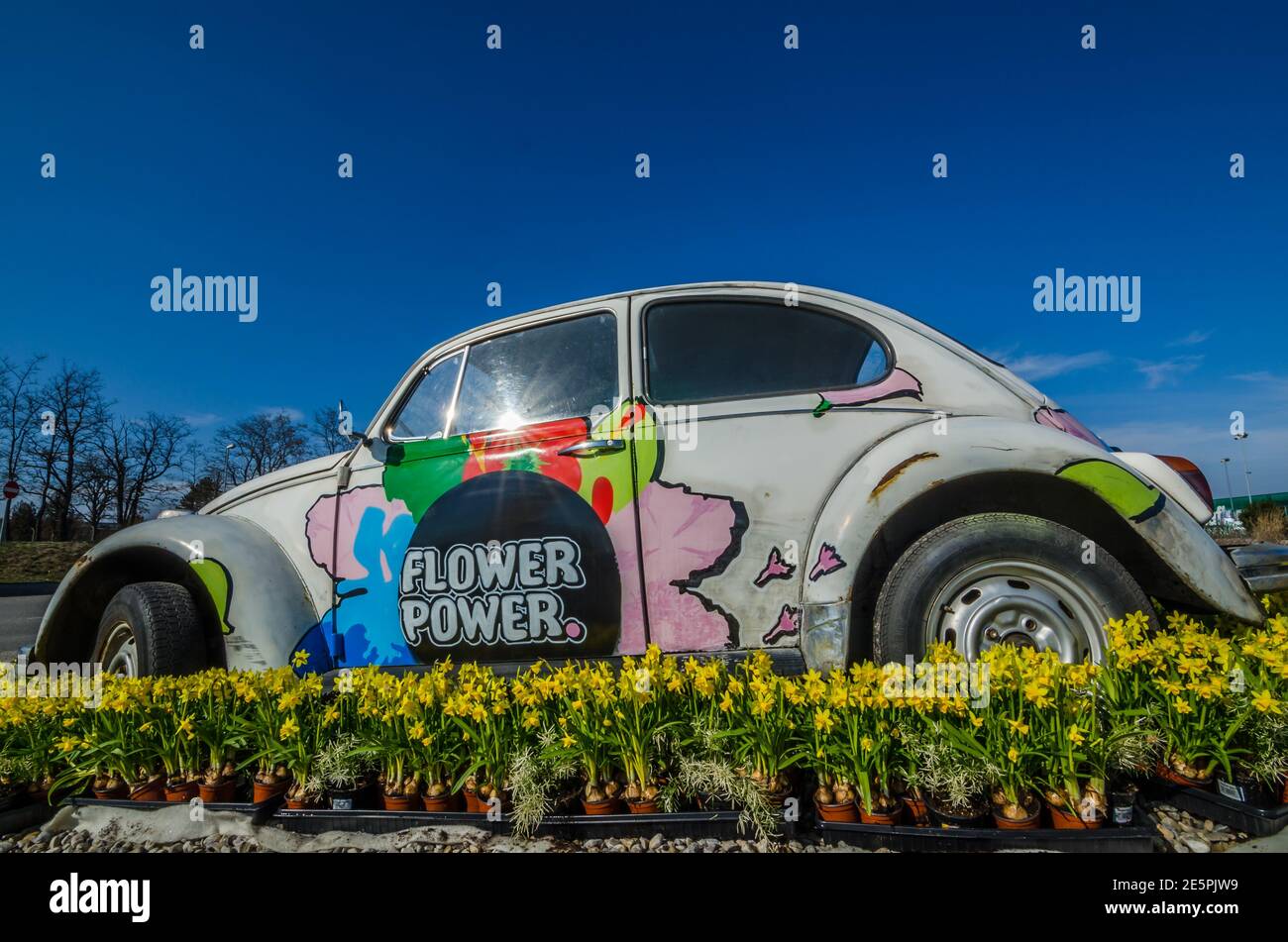 old flower power car with many flowers Stock Photo - Alamy