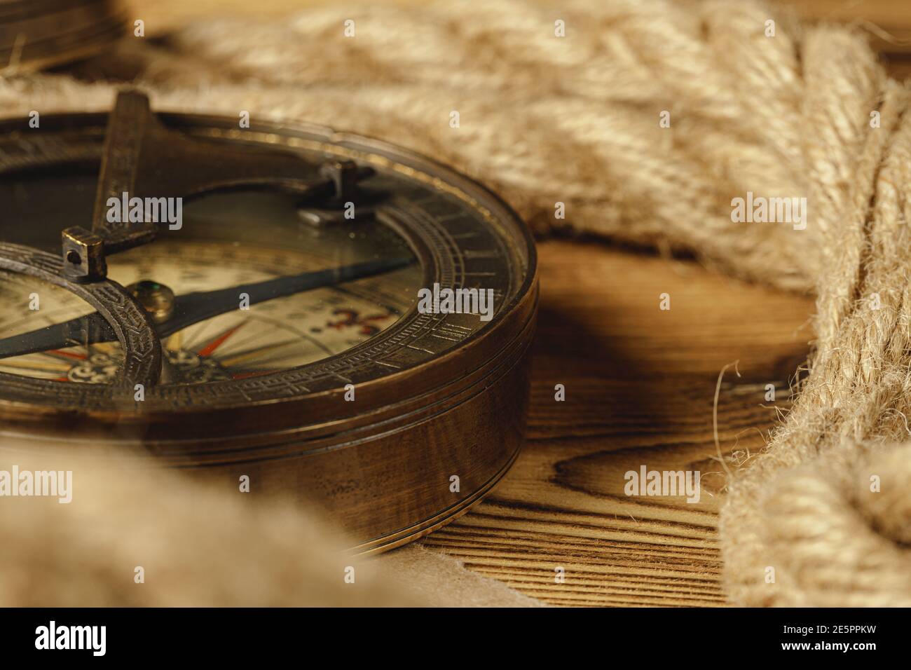 Ship rope and compass on wooden background Stock Photo - Alamy