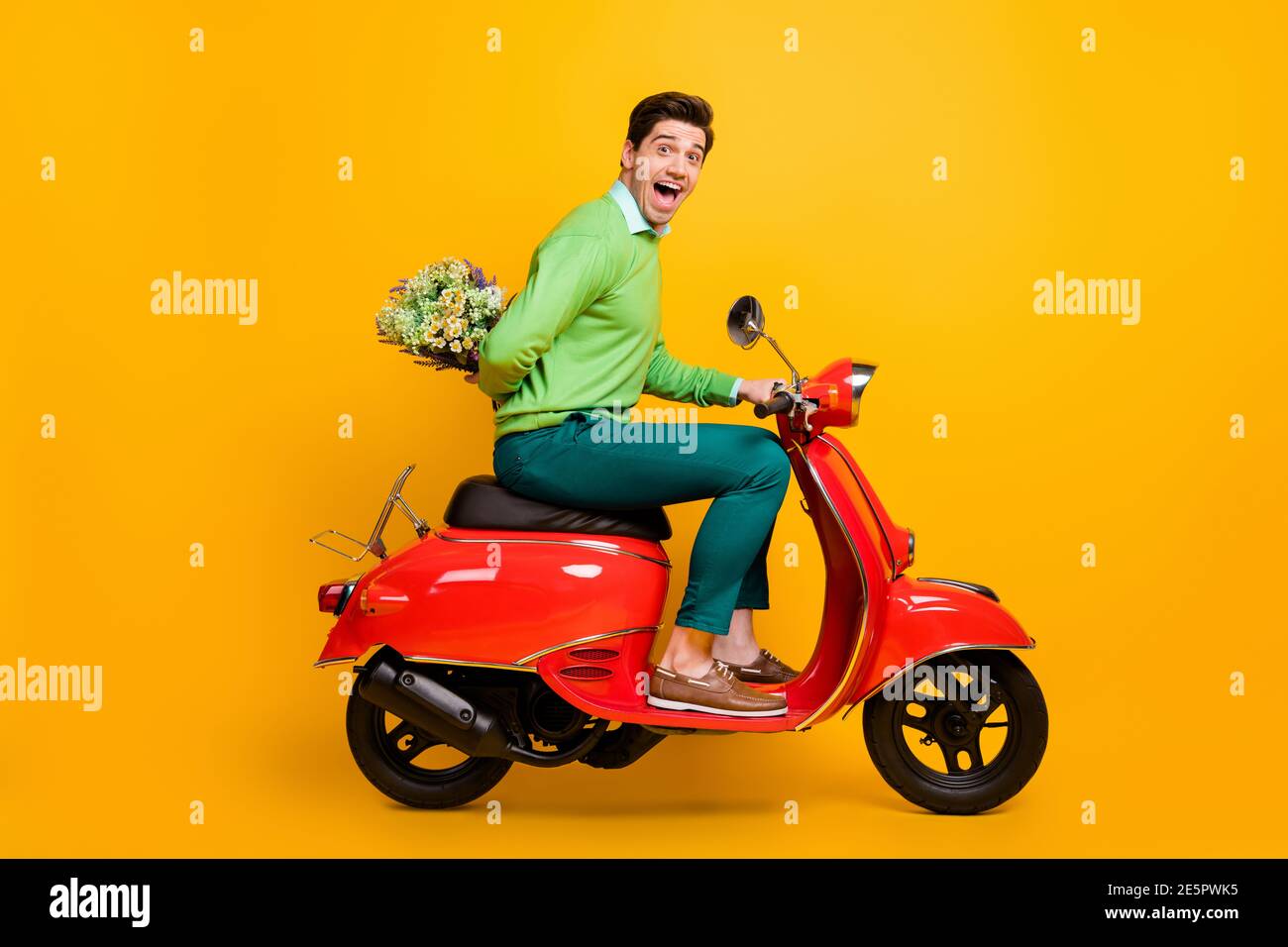 Full size profile portrait of funny person sit moped hide flower behind ...