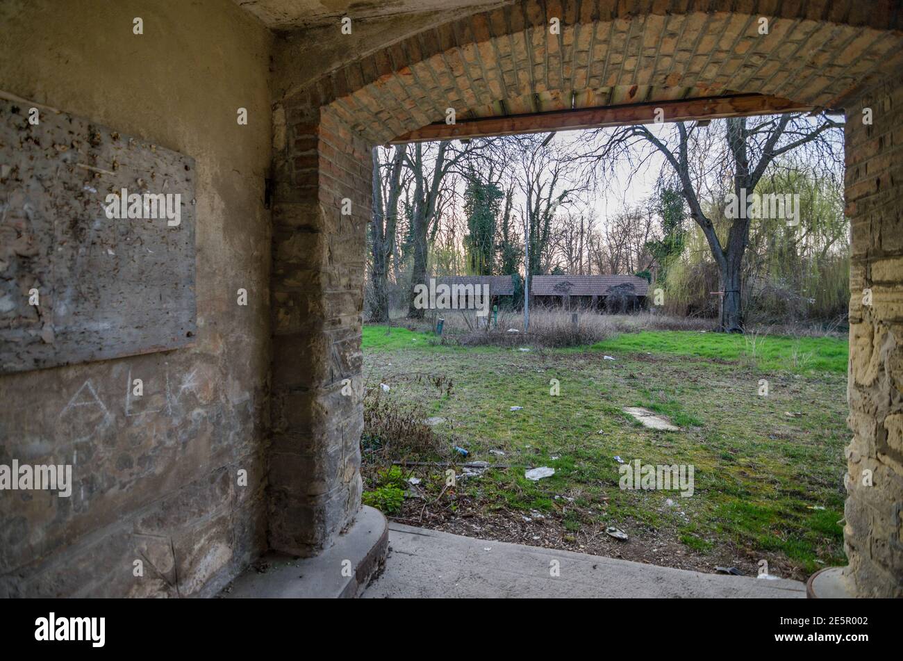 old passage in an abandoned courtyard on a terrain Stock Photo - Alamy