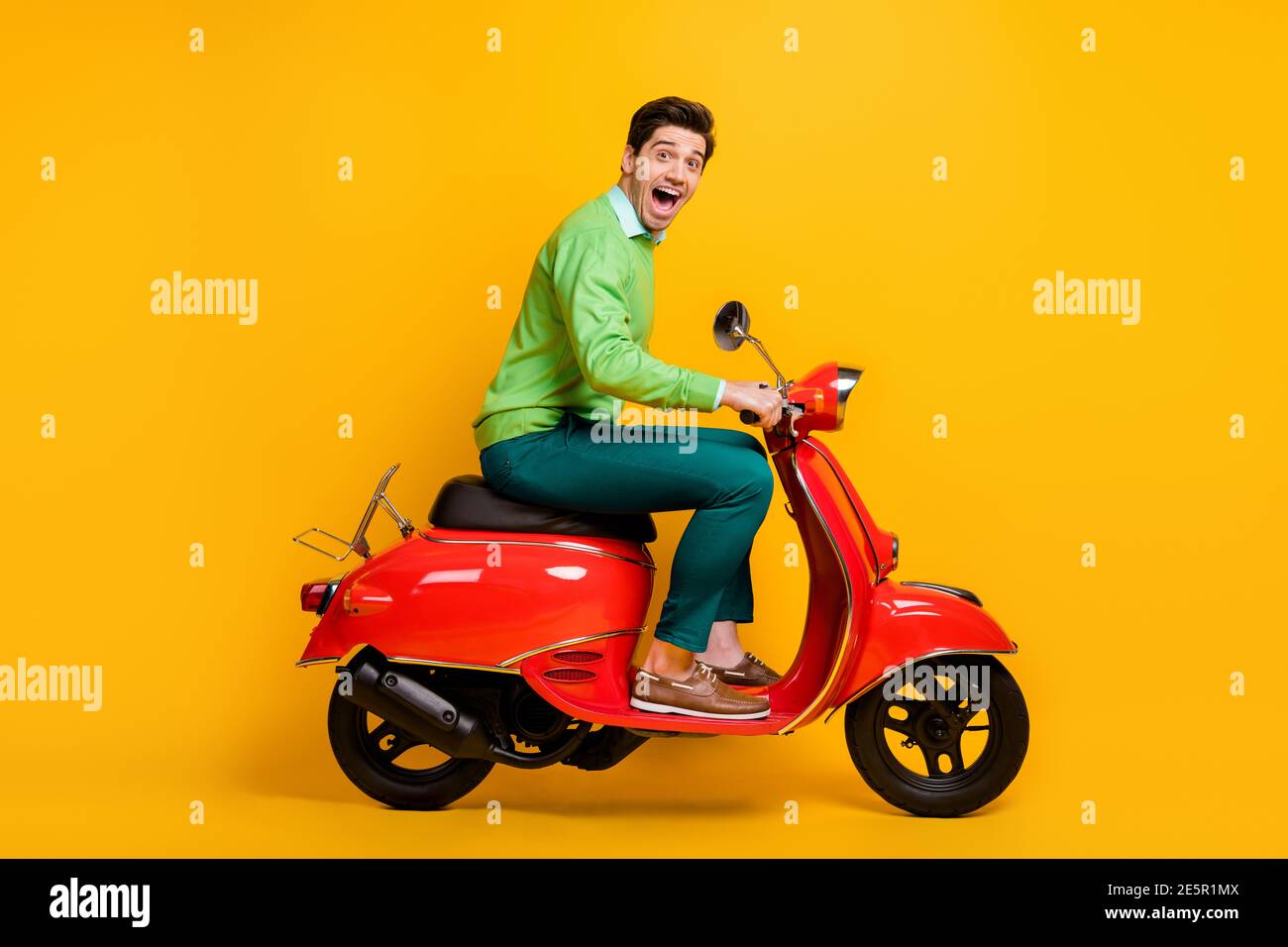 Full length profile photo of handsome guy driving moped open mouth wear ...