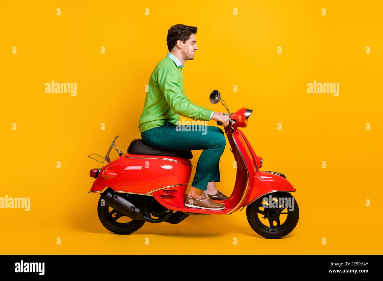 Full size profile photo of person driving moped wear sweater isolated ...