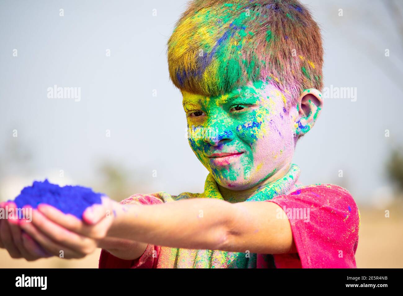 side view of selective rack focus from kid to hands, Young smiling kid ...