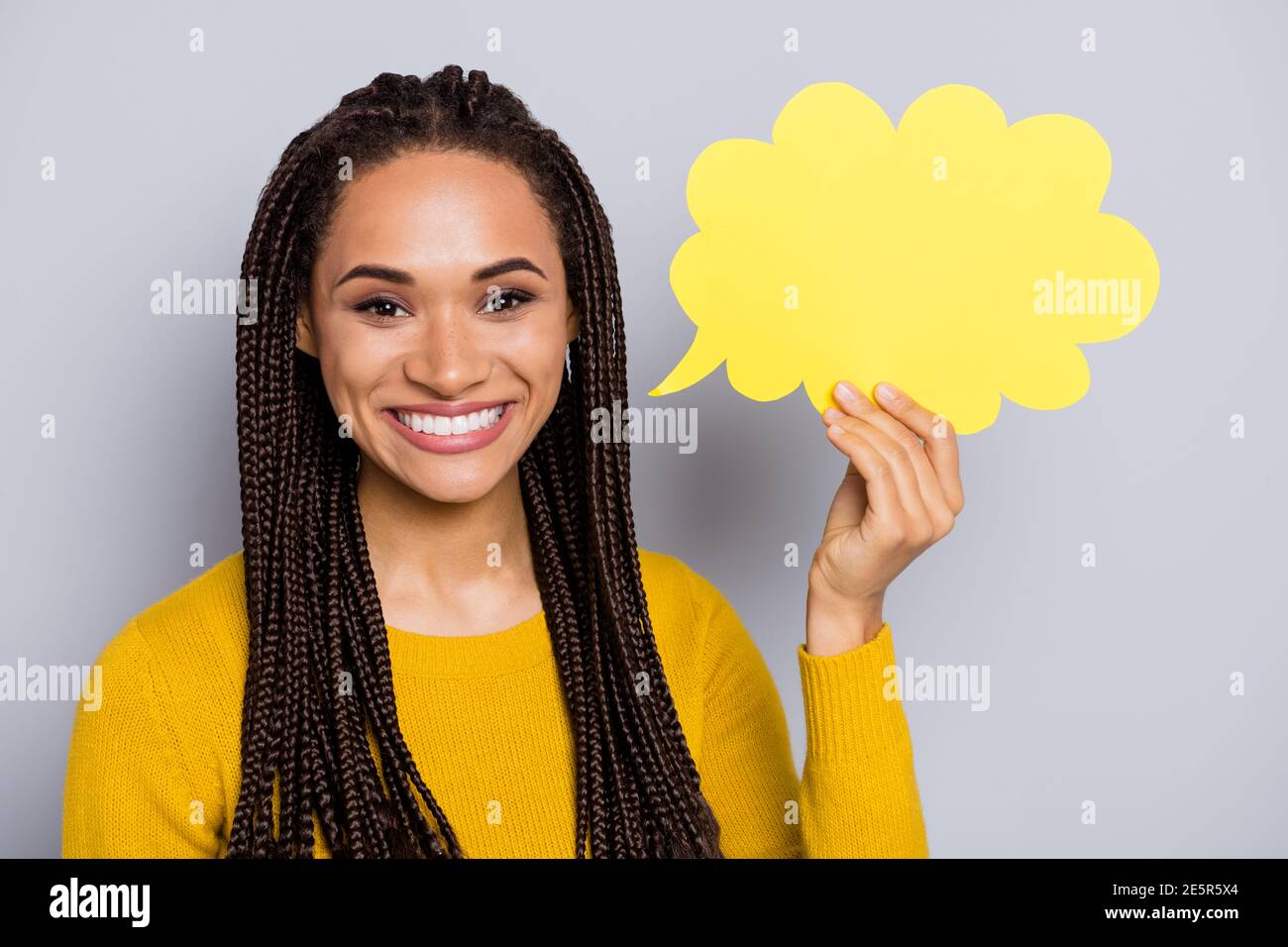 Photo of young attractive afro girl happy smile hold paper cloud isolated over grey color ...