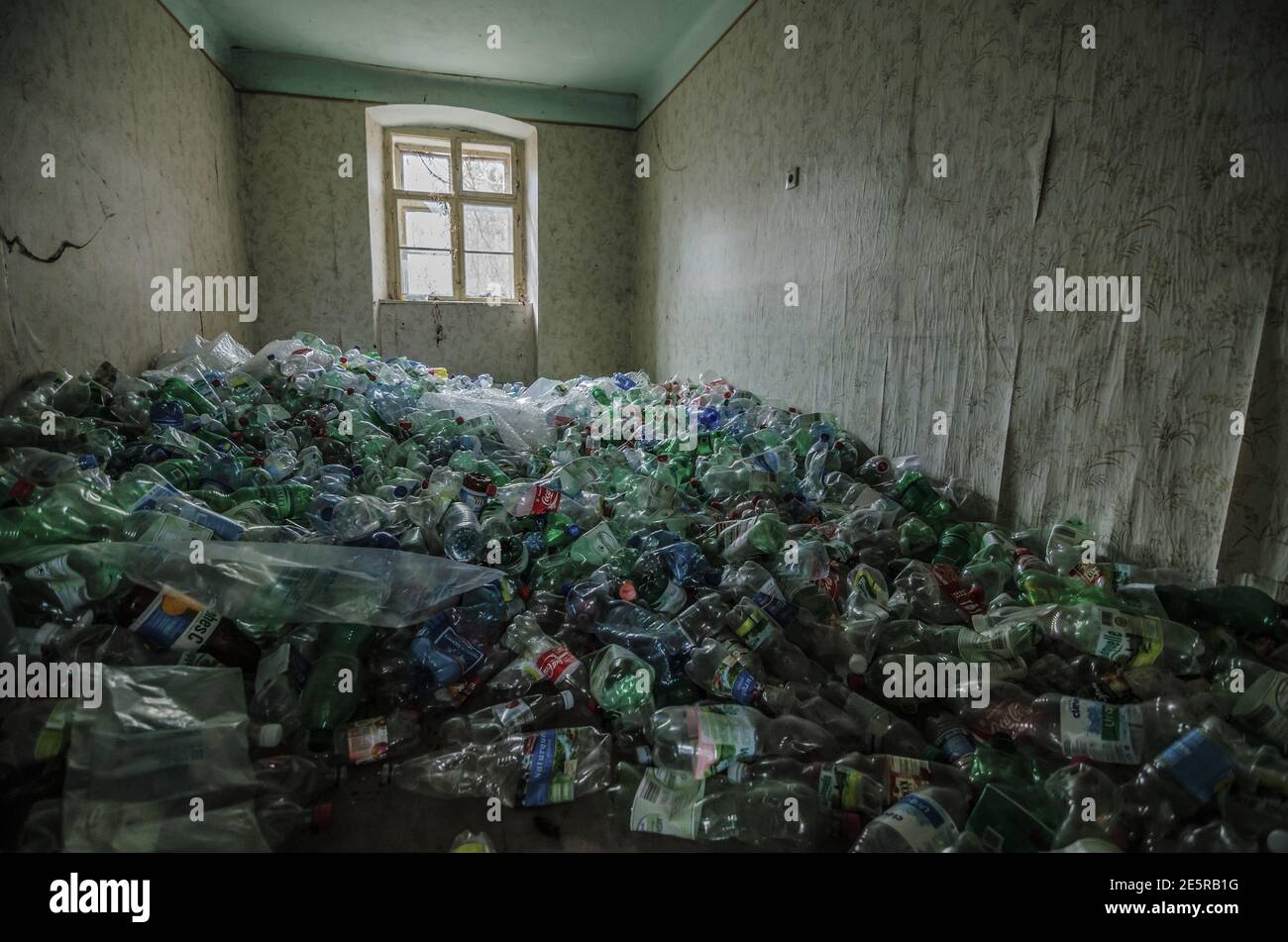 many empty plastic bottles in old room Stock Photo - Alamy