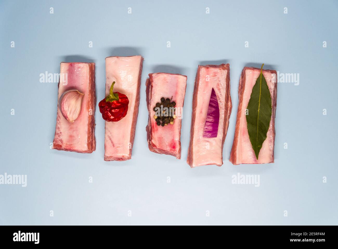 Top view of fresh meat with ingredients for cooking on white background ...