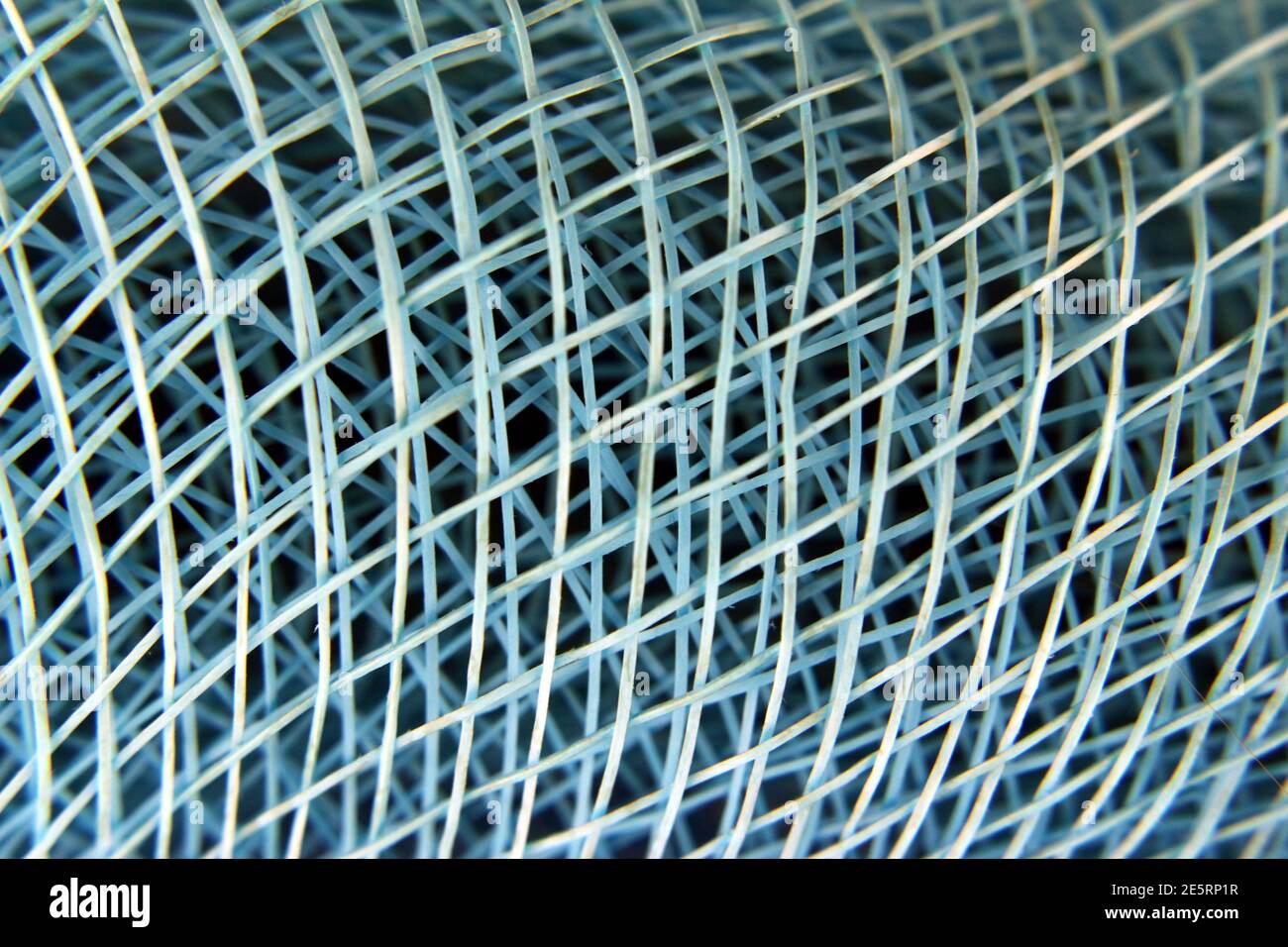 Woven net Detail of blue colored threads Stock Photo - Alamy