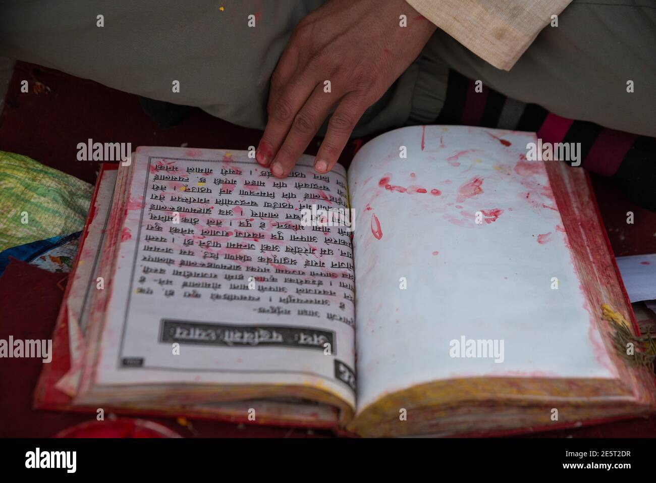 Nepalese Hindu priest recites the holy book during the festival. Madhav ...