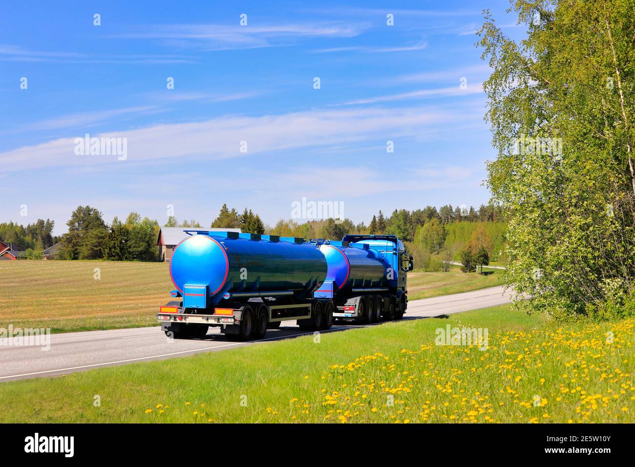 Blue Scania tank truck for bulk transport on highway 52 on a beautiful ...
