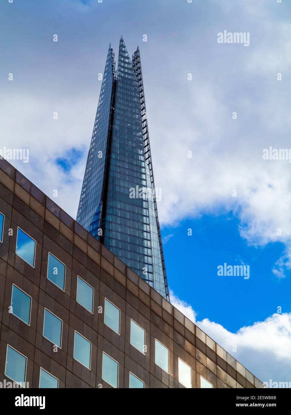 One London Bridge office block built in 1986 with the Shard Tower built ...