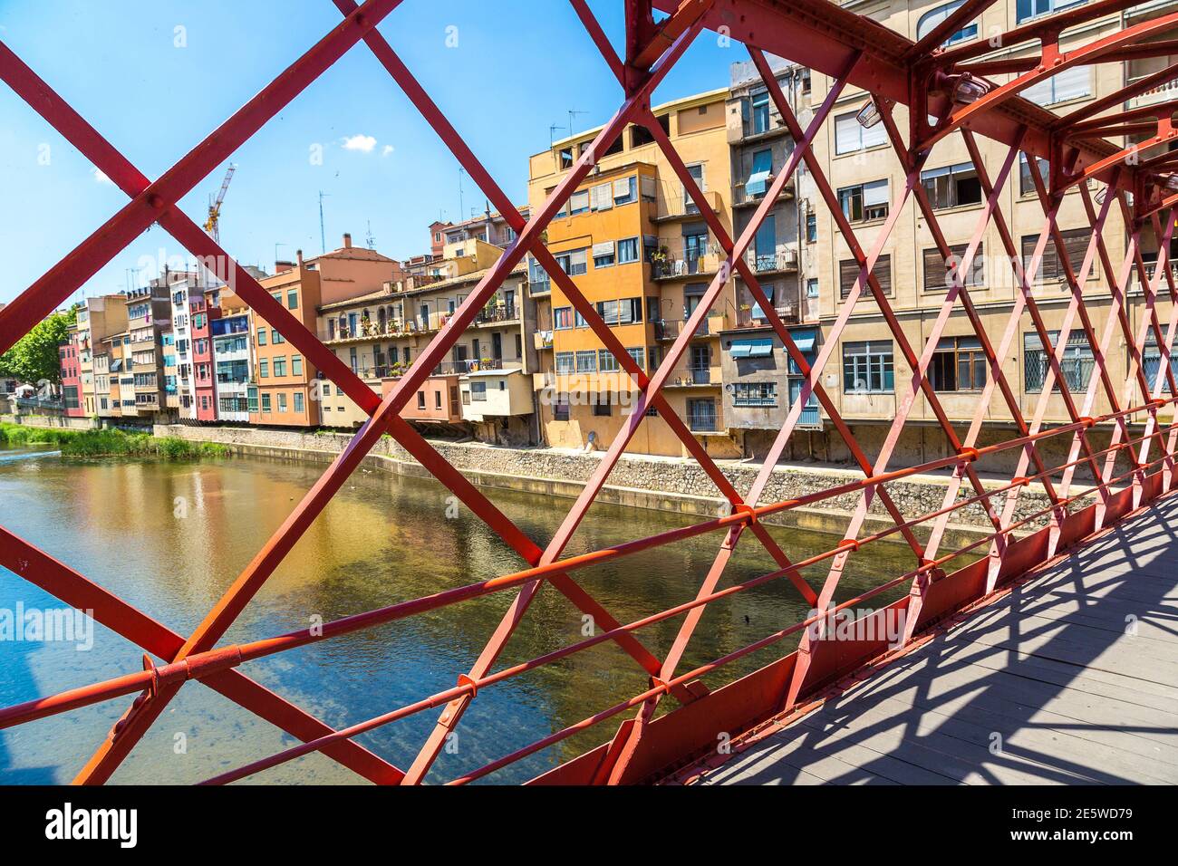 Red iron bridge - Eiffel bridge in Girona, in a beautiful summer day ...