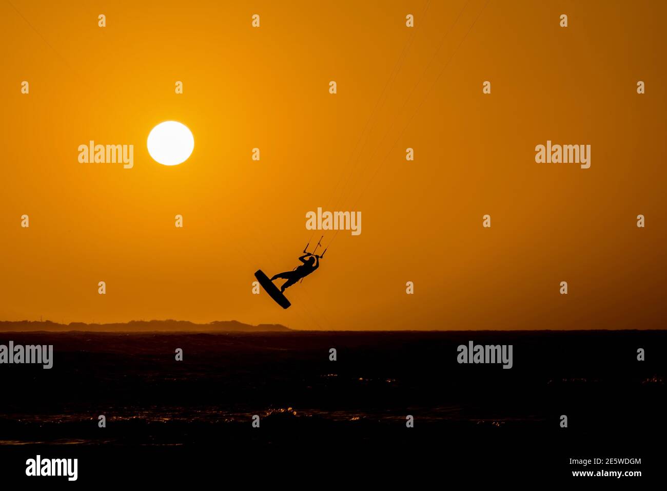 kitesurfer athlete rider jumping at sunset kiteboarding jump Stock ...