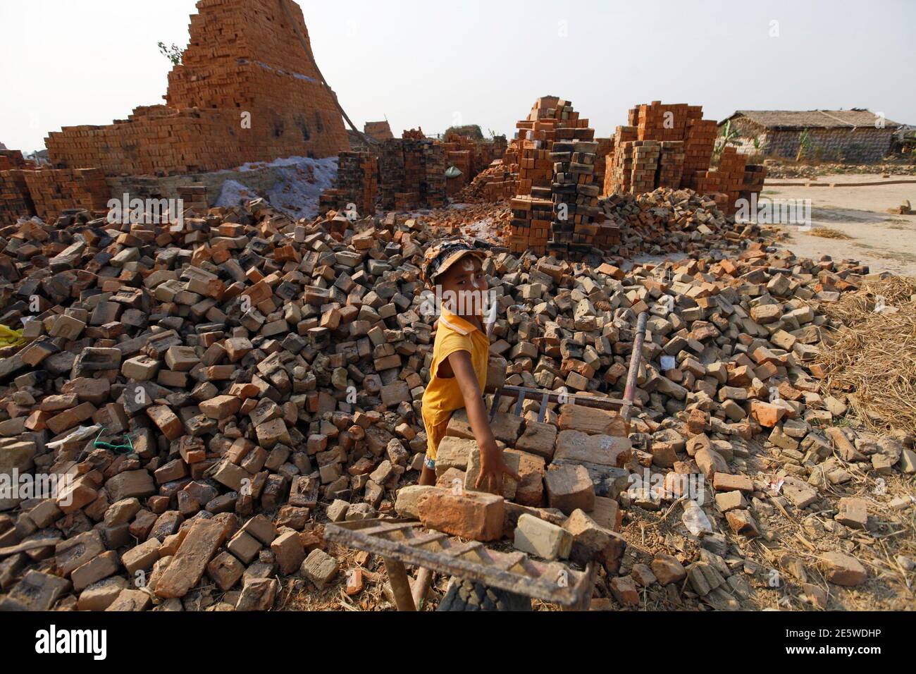Boy near pile of bricks hi-res stock photography and images - Alamy