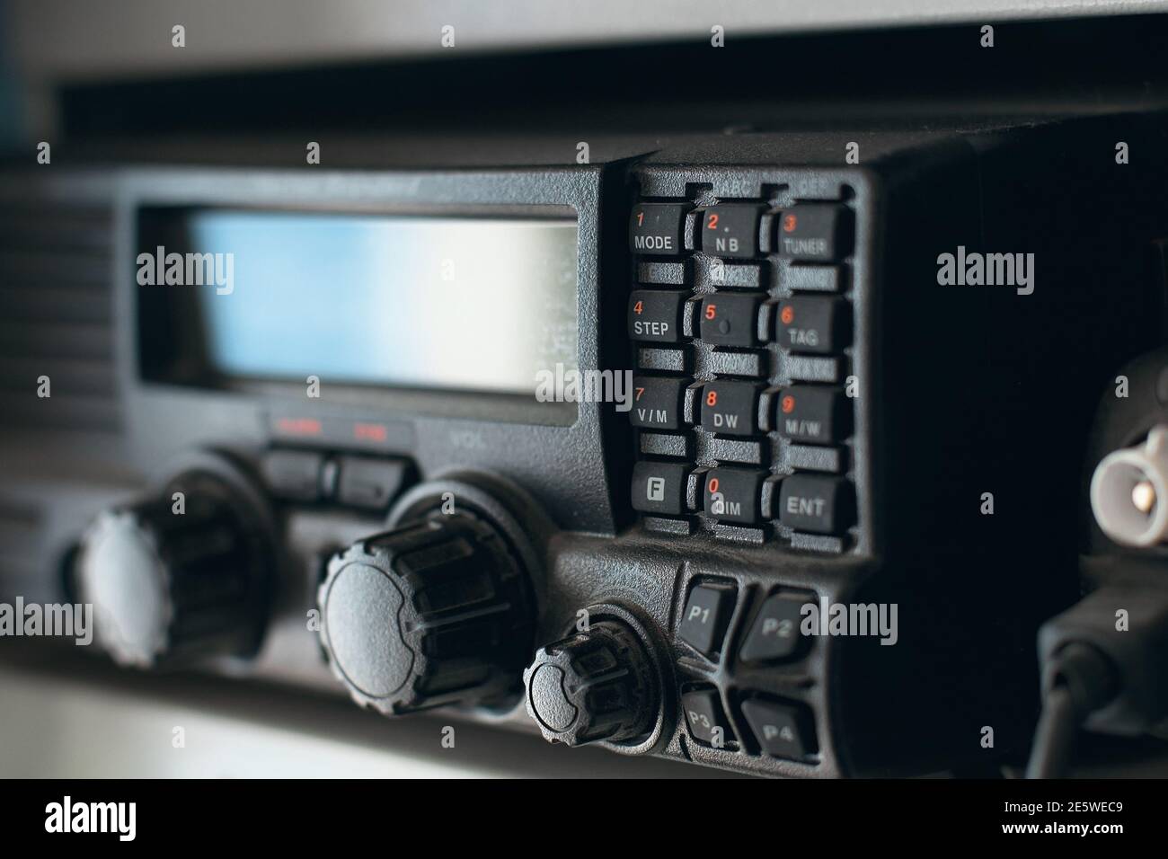 This is a close-up black portable radio station. Radio receiver with ...