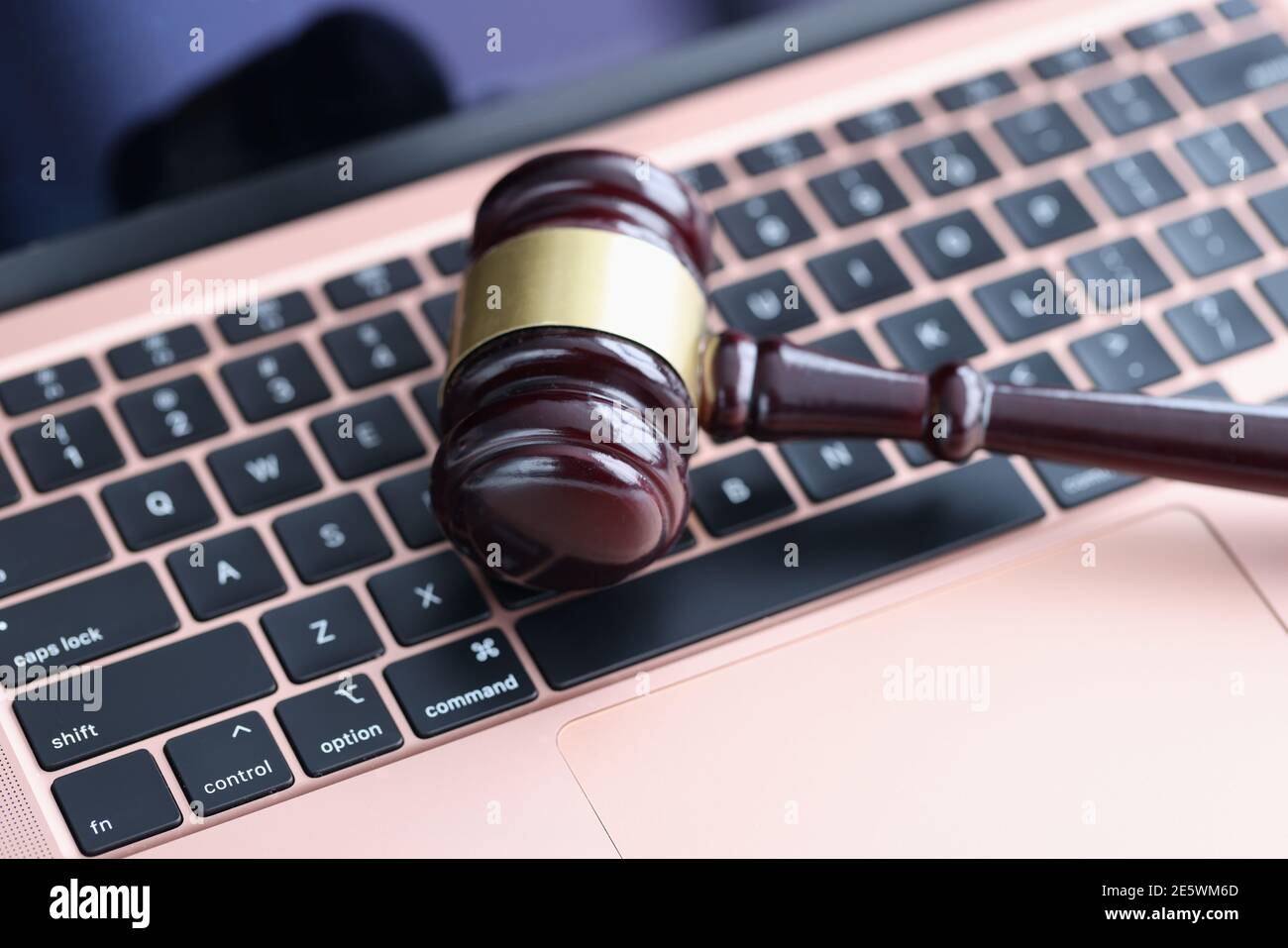 Judges hammer lying on laptop keyboard in courthouse closeup Stock ...