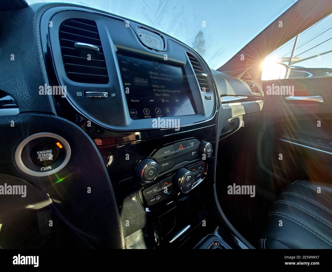 Inside view of a Chrysler automobile with sun visible featuring a ...
