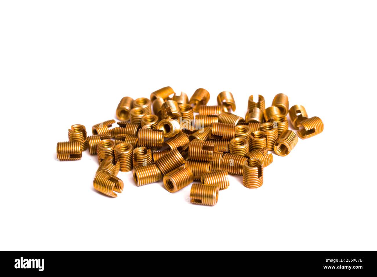 Small copper nuts isolated on white background Stock Photo - Alamy