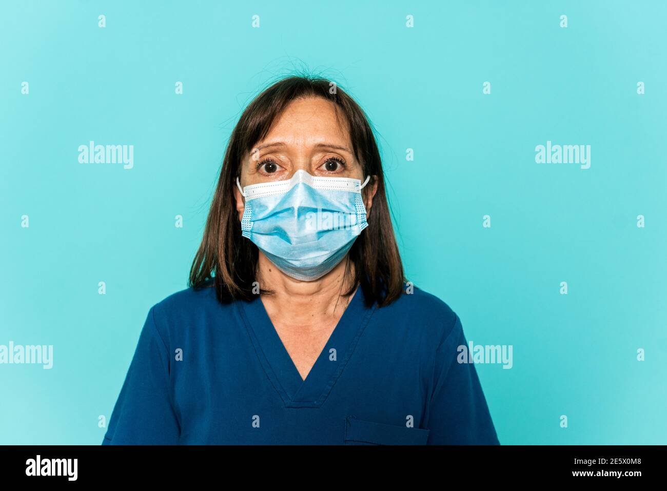 Stock photo of healthcare professional wearing face mask and disposable ...