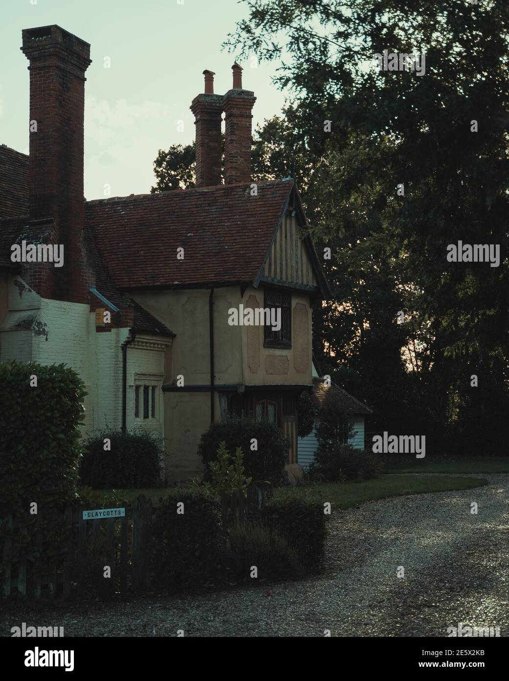 Vertical shot of a beautiful cozy house surrounded by trees Stock Photo ...