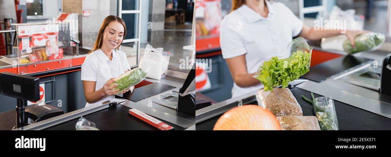 Smiling cashier holding lettuce while working on supermarket checkout ...