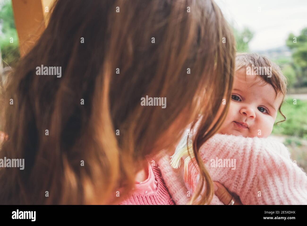 Young mother hugging her baby Stock Photo - Alamy