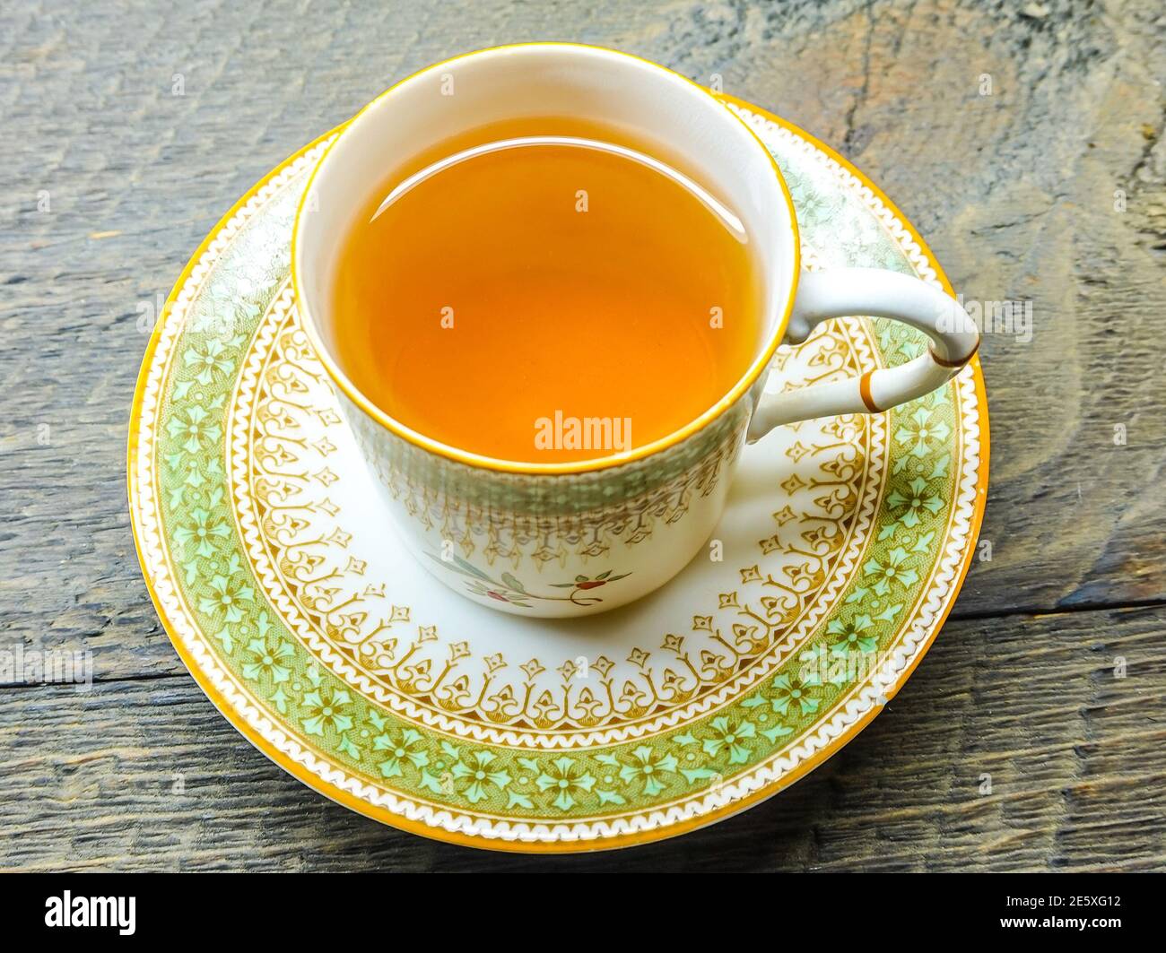 Hot tea in vintage picture of antique Victorian hot tea cup in saucer ...