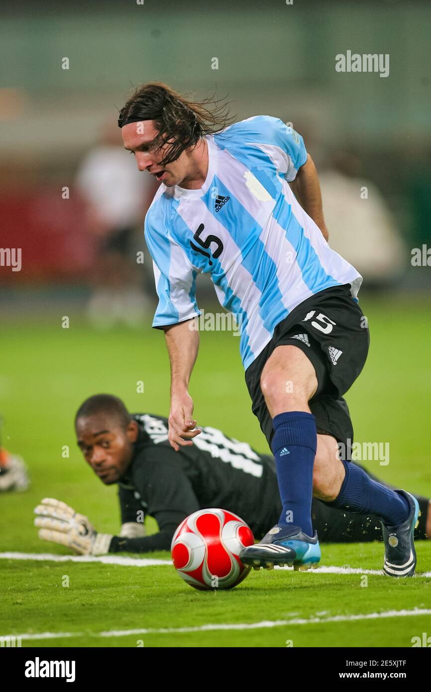 Lionel Messi goes around Netherlands goalkeeper Kenneth Vermeer to ...