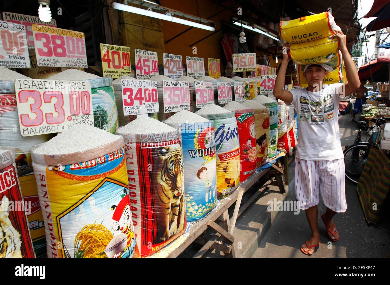 Man carrying sack rice on hi-res stock photography and images - Alamy