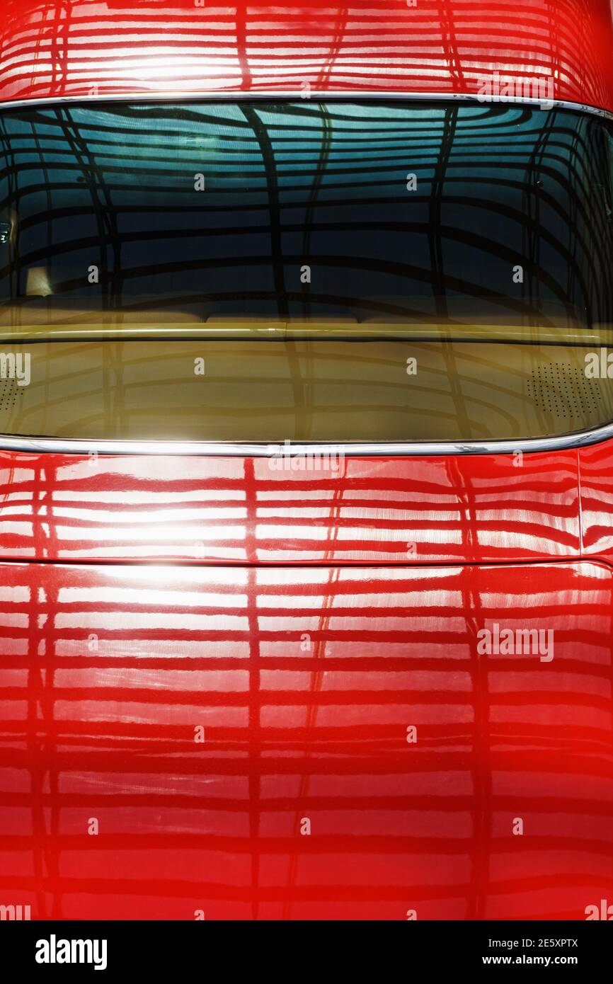 Red metal roof of a vintage retro car top view. Detail of the front ...