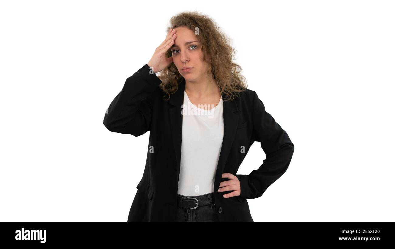 Beautiful woman in suit with hand on head showing gesture of concern or ...