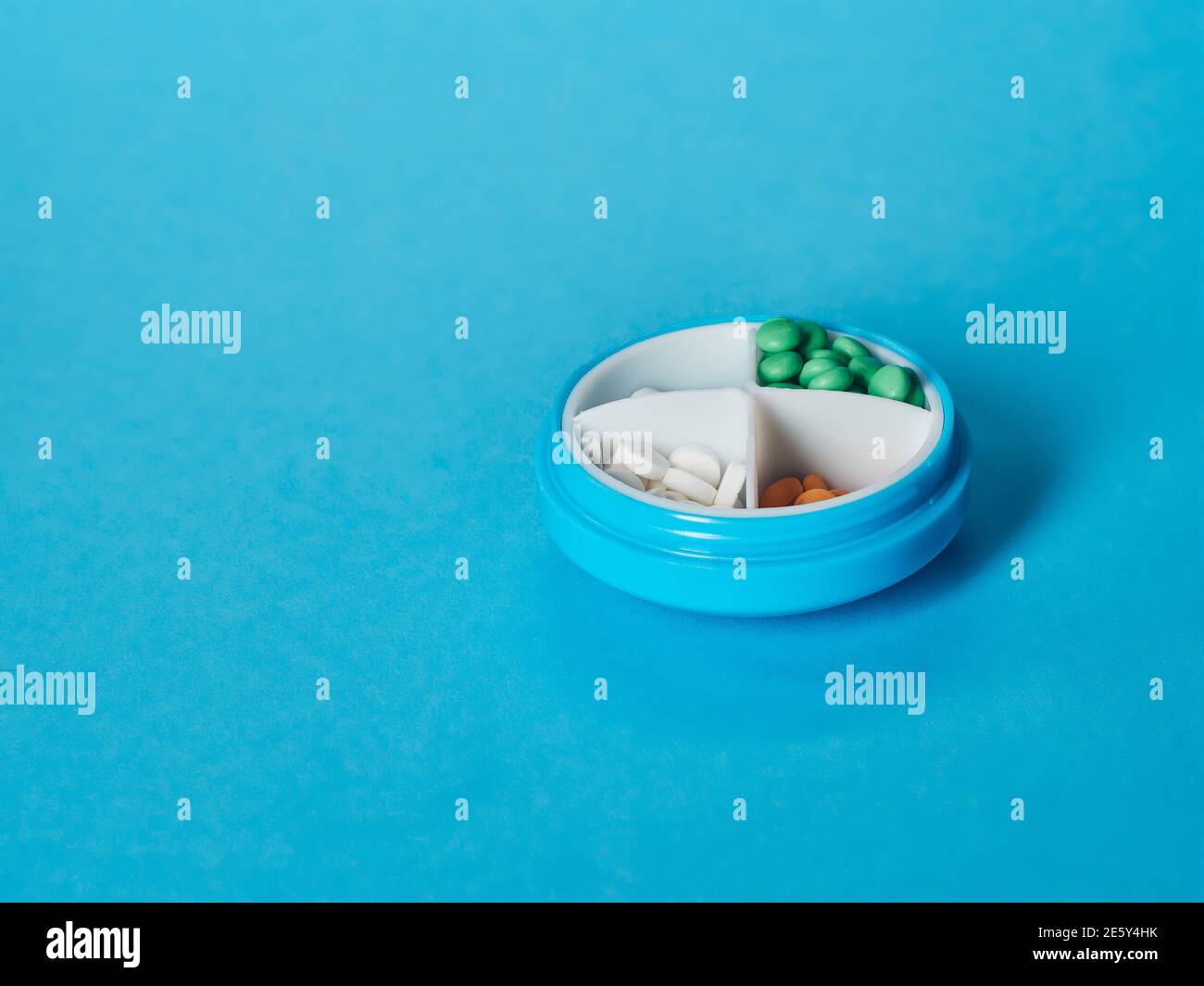 Blue pill box on a blue textured background. High quality photo Stock ...