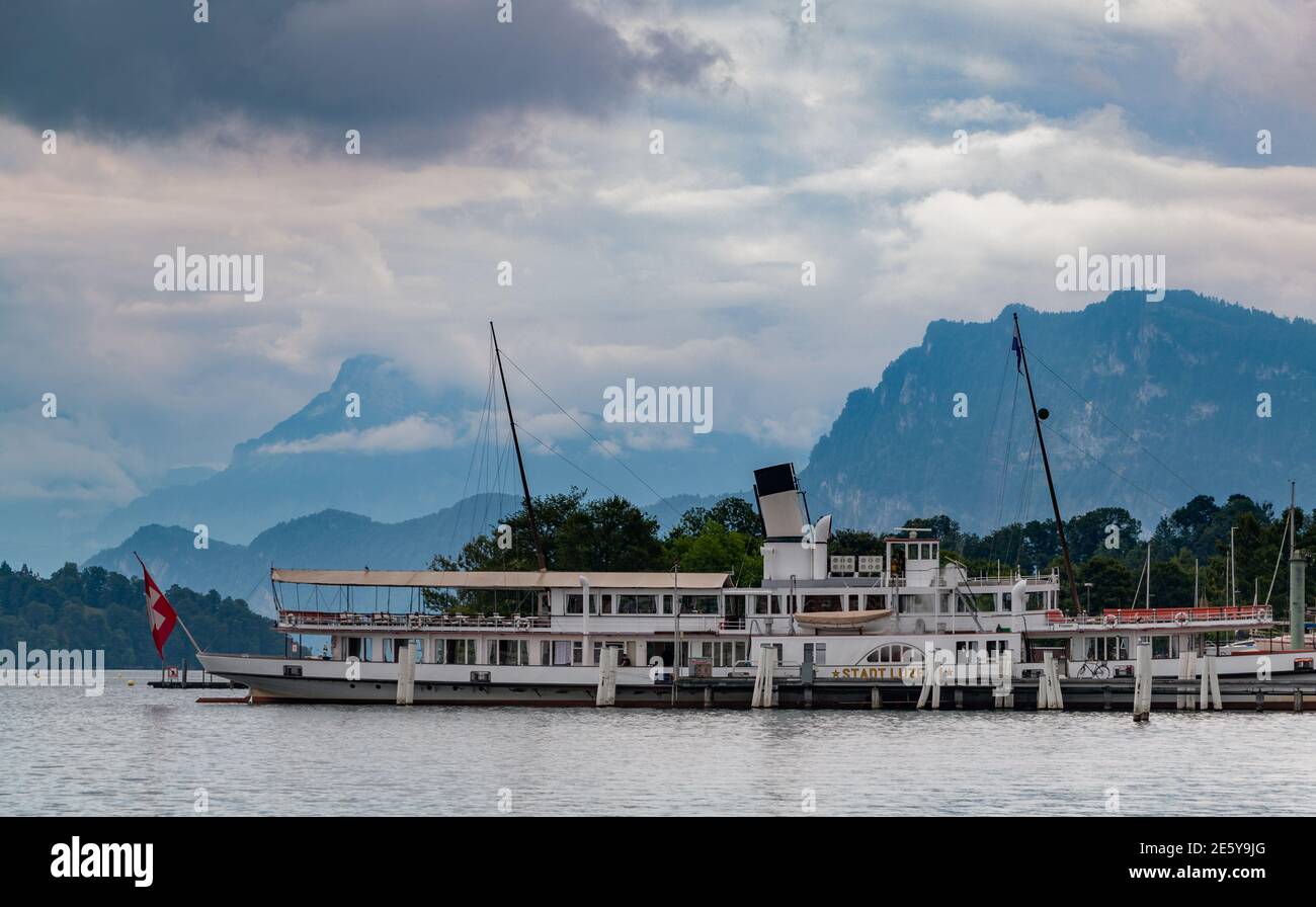 A picture of a boat docked in Lake Lucerne Stock Photo - Alamy