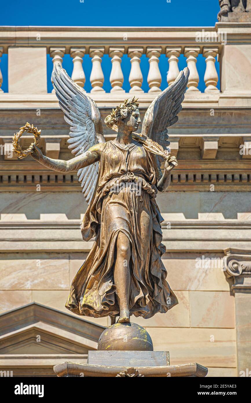 Statue of beautiful angel with wings at sunset colors in Prague ...