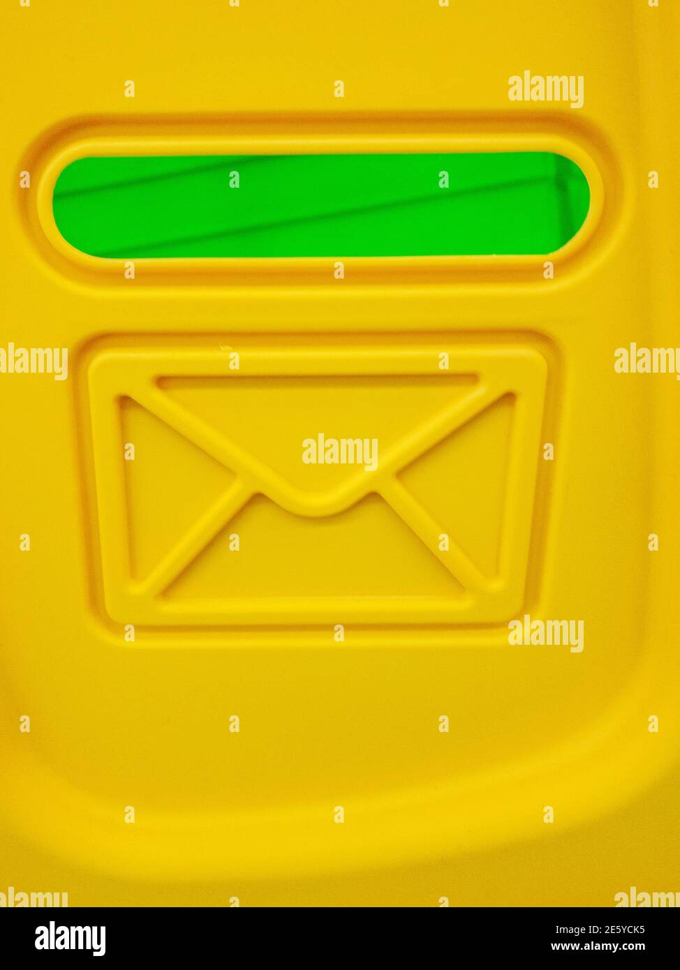 Yellow Plastic Mail Box With Big Slot Stock Photo - Alamy
