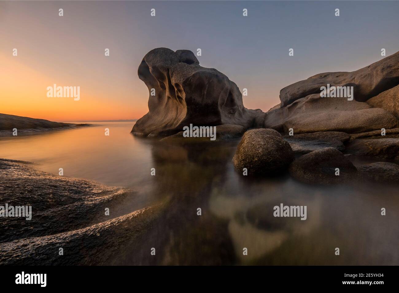 Singular rocks in the cala roques planes with sunrise Stock Photo - Alamy