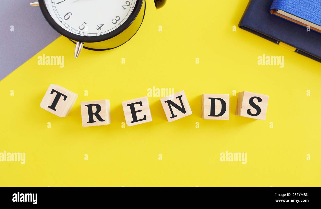 Trends Word written on wooden blocks. Concept for trends .yellow and ...