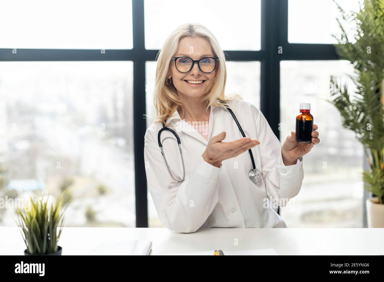 The doctor recommends an effective medicine. A portrait of smiling ...