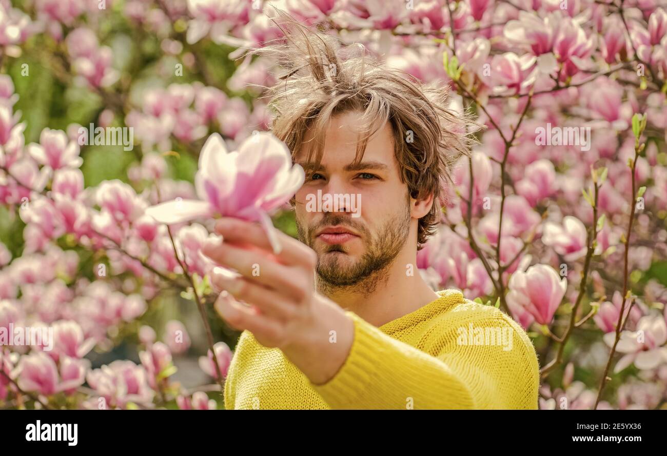 Guy relax in flowers park. Botanical garden. Freshness and awakening ...